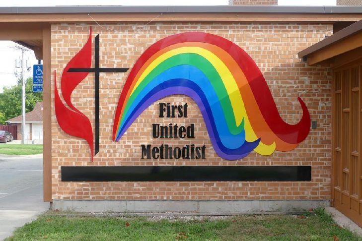 New signage at Decorah Methodist Church declares it is "an open ...